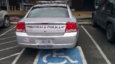 Bothell Police car, Seattle city van spotted in handicap spots | king5.com