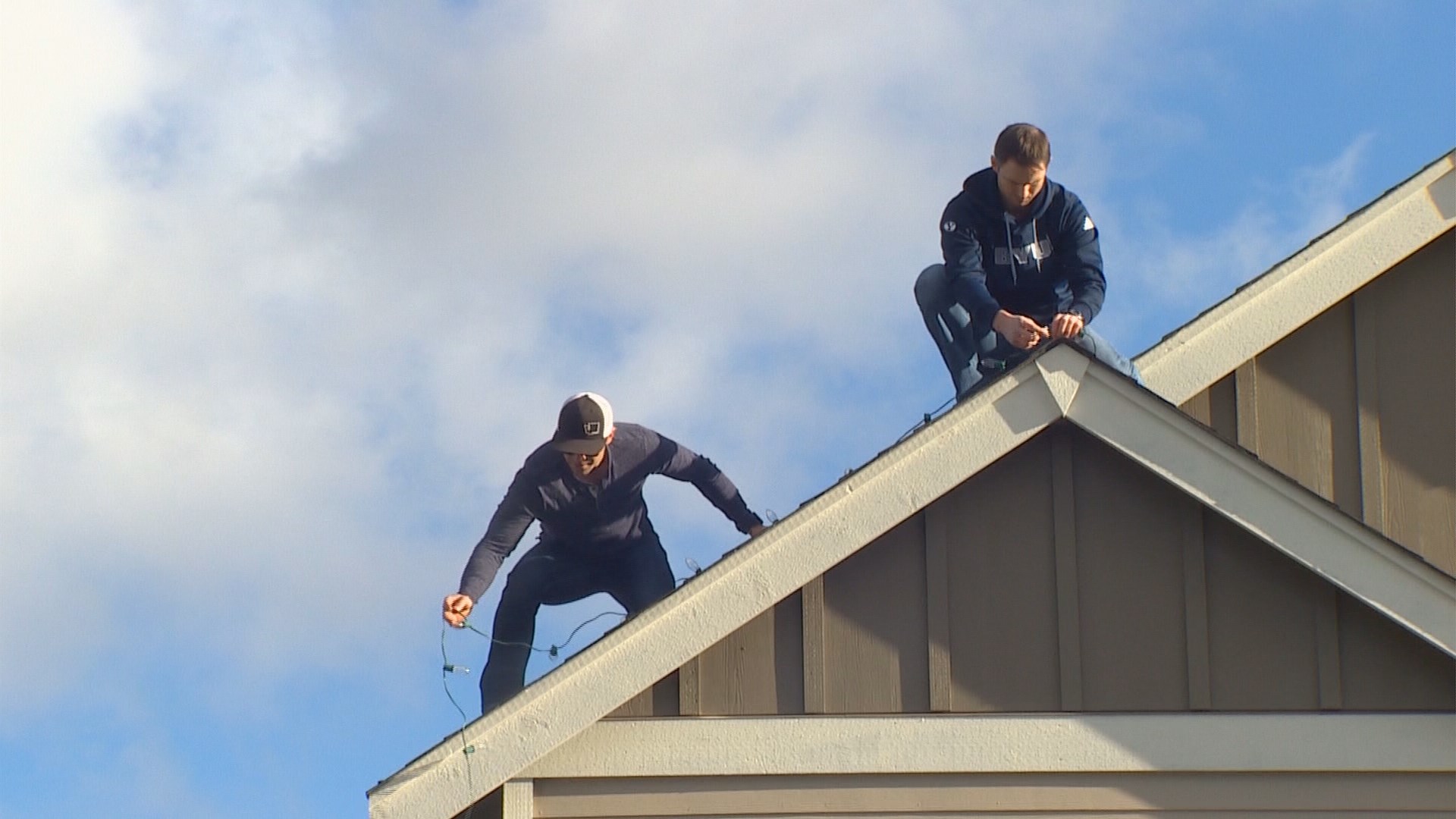 Firefighters hang Christmas lights after man falls off ladder | king5.com