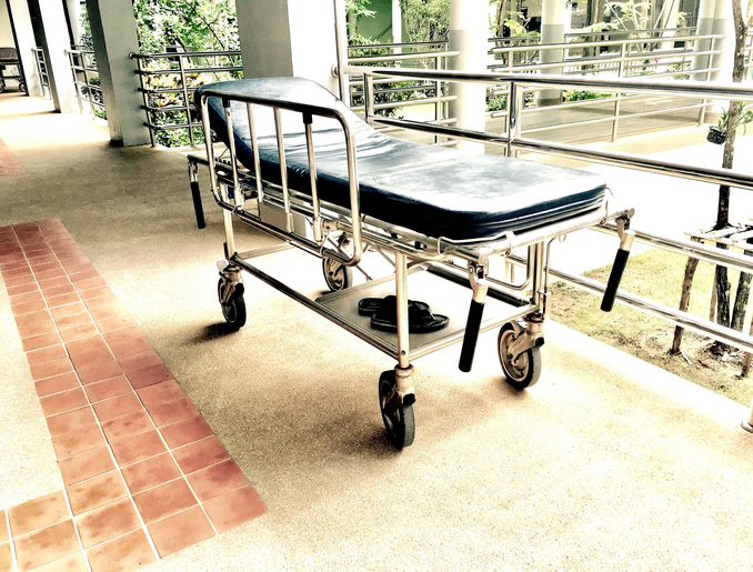 Gurney holding deceased person falls from van into traffic | king5.com